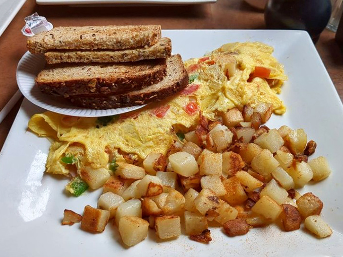 Breakfast geometry at its finest&mdash;perfectly golden omelet, crispy home fries, and hearty toast forming the triangle of morning happiness.