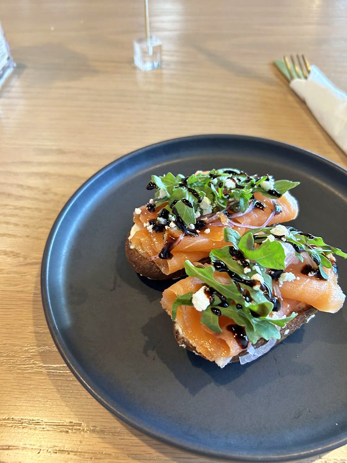 Smoked salmon toast that's dressed better than most people at brunch. That balsamic drizzle is the jewelry this dish wears to feel fancy.