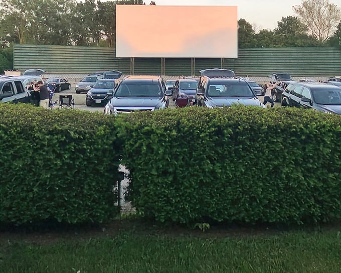 Melody 49 Drive-In's screen stands tall against the evening sky&mdash;a monument to simpler entertainment that somehow feels more meaningful today.
