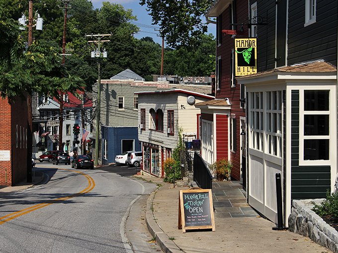 Sunlight plays between historic brick buildings where modern shops thrive in century-old spaces.