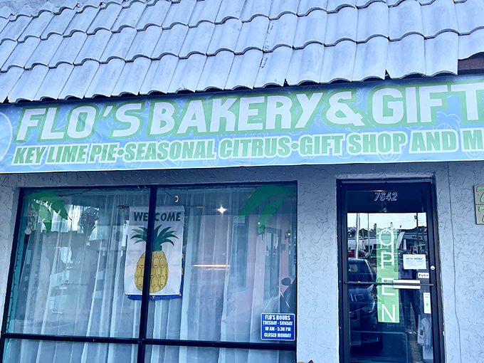 Flo's neon sign glows with tropical promise &ndash; part bakery, part gift shop, all Florida charm.