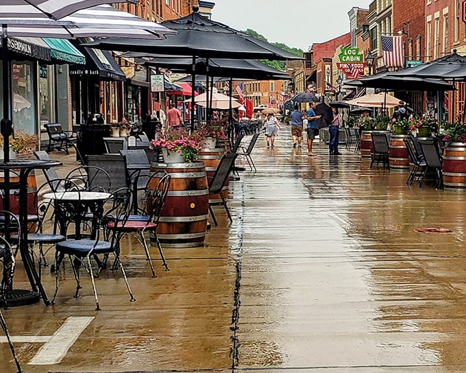 Where brick buildings and barrel tables create the perfect setting for afternoon people-watching. Rain can't dampen the spirit of this inviting main street!