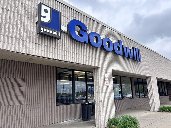 Goodwill's iconic blue sign stands out against the textured white building. A beacon of bargains in Hermitage for generations of thrifty shoppers.