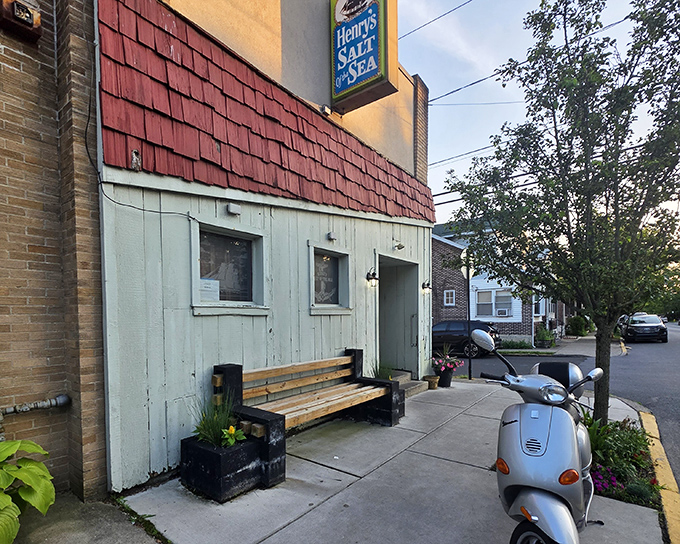 Henry's weathered white siding and simple bench tell a story: great seafood doesn't need fancy wrapping to be extraordinary.