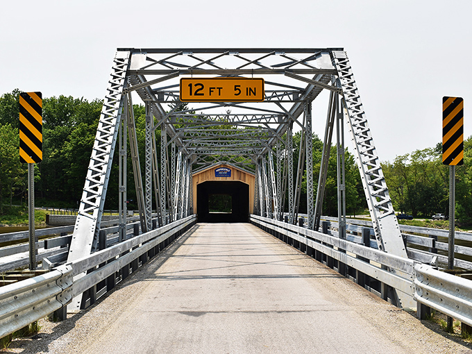 Engineering meets nostalgia where metal framework cradles wooden history. That height warning isn't kidding around!