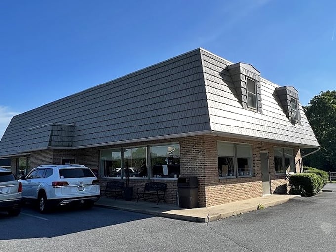 Katie's Kitchen's brick-and-siding exterior hides culinary treasures within. That "OPEN" sign is your invitation to comfort food paradise.