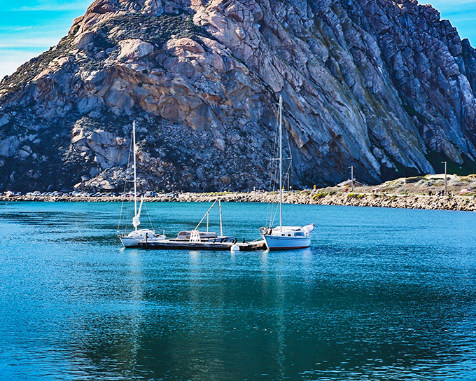 Morro Rock stands guard over the harbor like nature's own lighthouse watching fishing boats. 