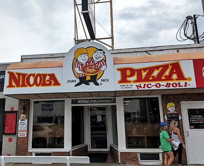 Nicola's charming cartoon mascots have greeted hungry beachgoers for generations. The famous Nic-o-Boli awaits inside those doors.