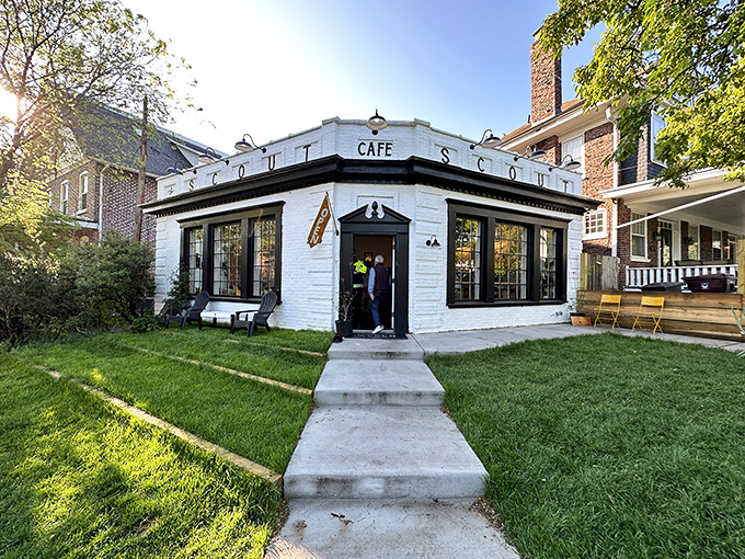 Scout Cafe's pristine white building stands like a friendly neighborhood beacon, promising good coffee and even better conversations.