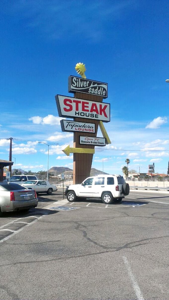 That classic roadside sign is like a beacon to beef lovers &ndash; Silver Saddle's vintage marquee has been guiding hungry travelers for generations.