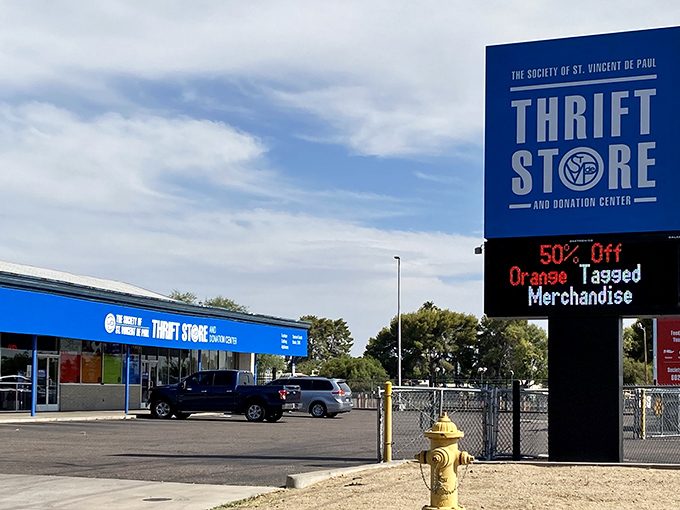 St. Vincent de Paul's vibrant blue storefront pops against the desert landscape, advertising deals that make bargain hunters' hearts race.