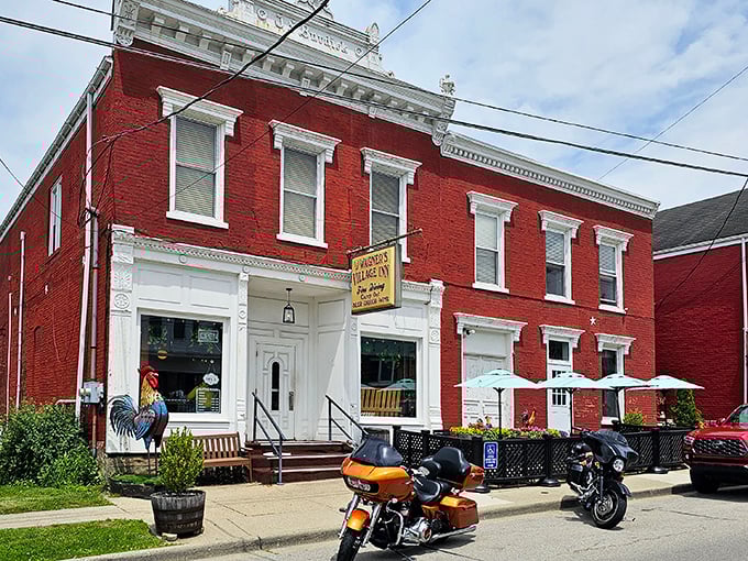 Wagner's Village Inn's striking red brick exterior makes a bold statement. That colorful rooster statue isn't just decoration&mdash;he's the neighborhood's most popular food critic!