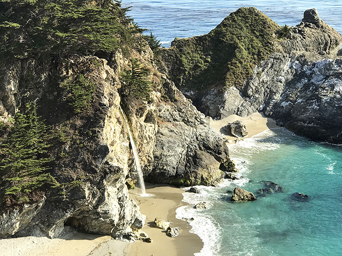 A waterfall that empties directly onto a beach? California's showing off again with this postcard-perfect scene.