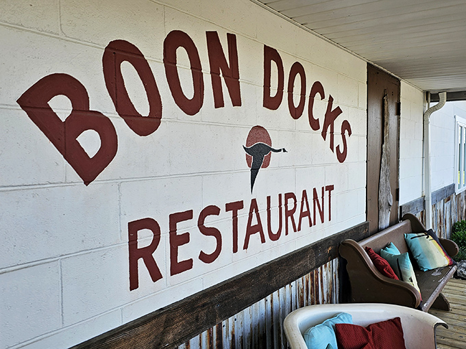 The hand-painted sign says it all—authentic, no-nonsense, and absolutely delicious. Waterside dining without a hint of pretension.