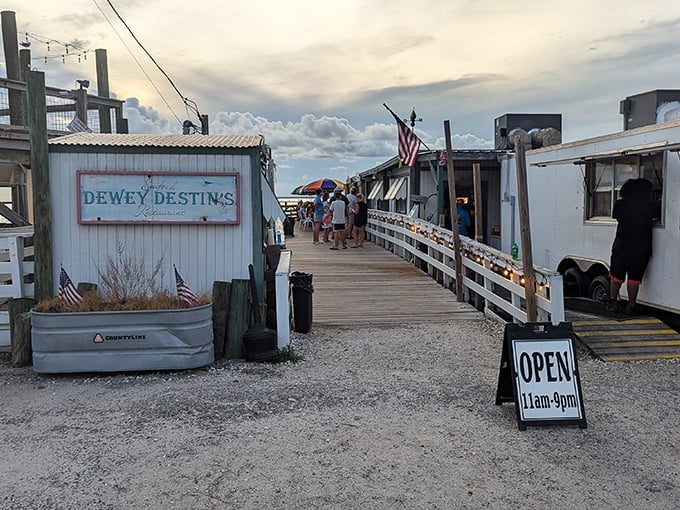 Dewey Destin's waterfront setup looks like it was designed by someone who understands that great seafood needs nothing more than fresh air and good company.