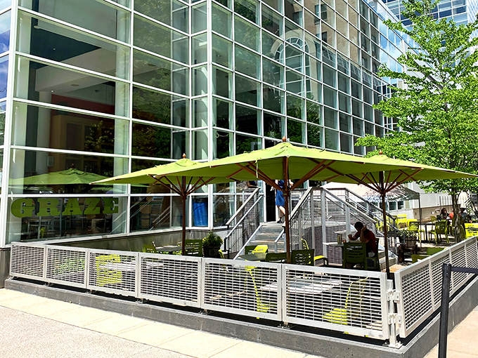 Those bright green umbrellas and sleek glass walls create the perfect setting for people-watching while devouring crispy, locally-sourced chicken.