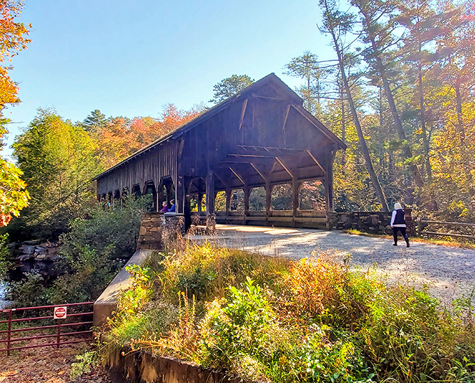 Step right into a storybook &mdash; this weathered bridge framed by fiery leaves looks like it&rsquo;s waiting for a Hallmark crew.