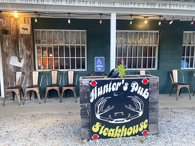 Metal chairs, string lights, and a hand-painted sign—Hunter's Pub is where pretension goes to die and flavor thrives.