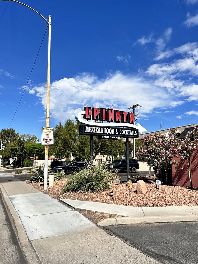 Desert landscaping frames La Piñata's entrance - a perfect Arizona welcome before the chimichanga fiesta begins inside.