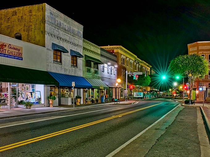 Night brings a peaceful glow to Lake City's storefronts. Like fireflies in glass jars, these shops light up the evening for after-dinner strolls.