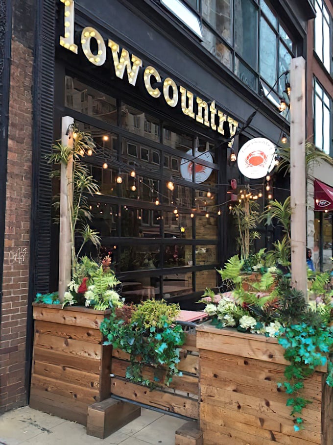 String lights, wooden planters, and the promise of messy, delicious seafood—Lowcountry's entrance sets the perfect mood.