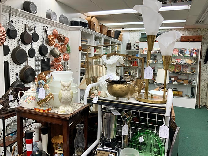 Cast iron meets delicate porcelain in this meticulously organized treasure trove where vintage kitchen tools find new purpose.