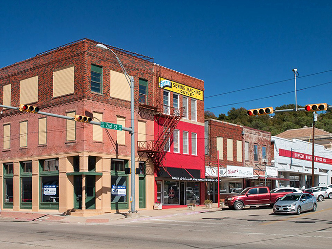 Downtown storefronts in Mineral Wells &ndash; where window shopping still means actually looking through windows, not scrolling.