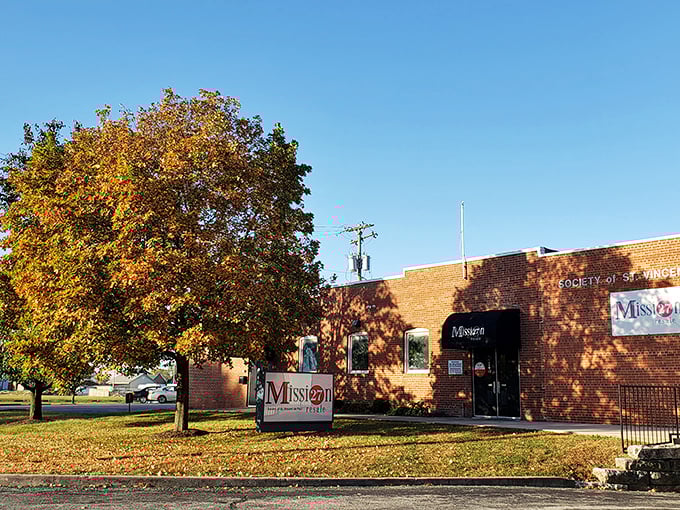 Fall colors frame this Mission 27 location, where autumn treasures await inside. The brick building holds seasonal surprises for patient browsers.