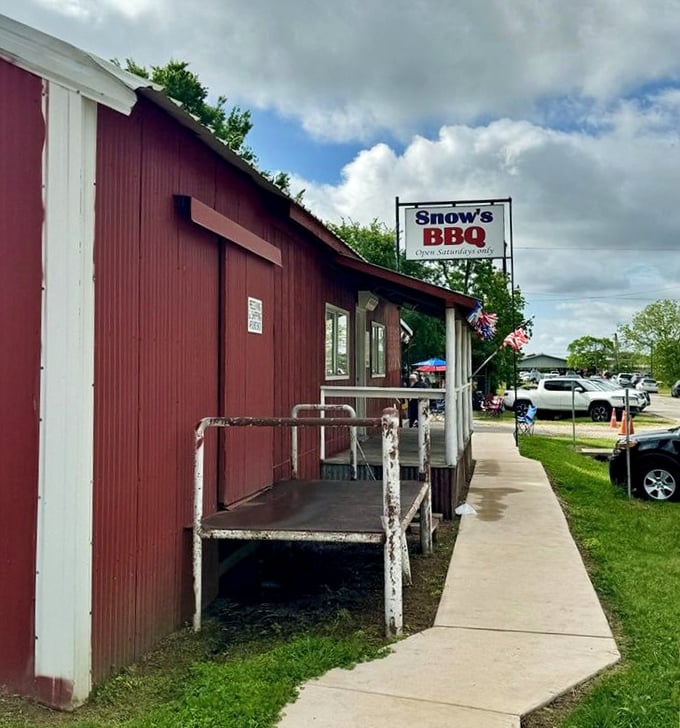 The humble red siding of Snow's BBQ hides legendary status. Where barbecue pilgrims gather weekly for smoky salvation.