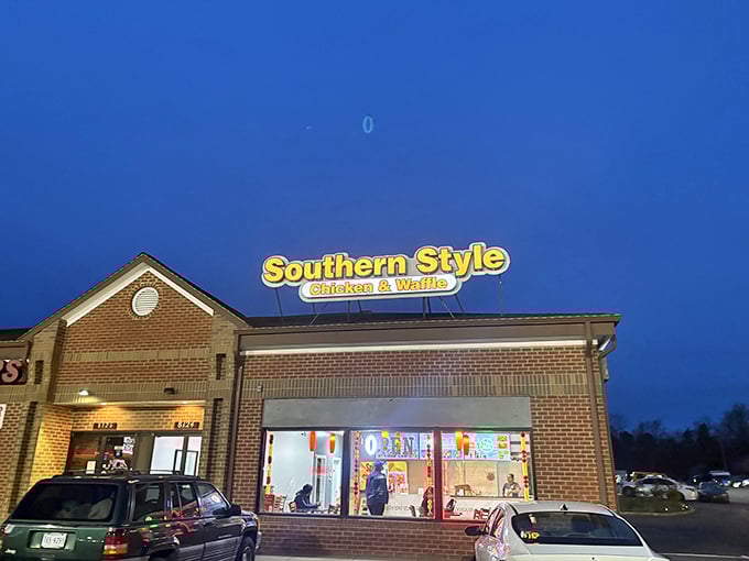 As night falls, that glowing sign becomes a lighthouse guiding you to crispy chicken salvation.