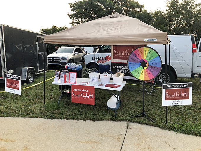 The colorful wheel of fortune adds playful charm to this wholesome market where good deals support good causes.