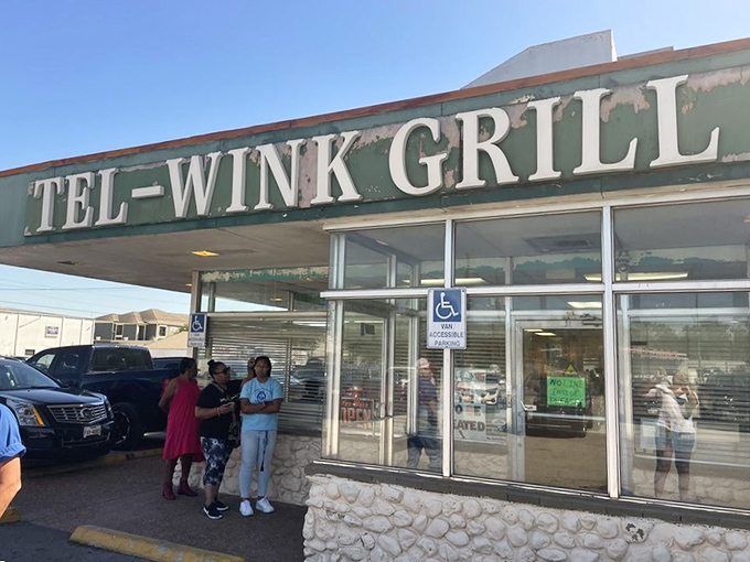 The unassuming exterior of Tel-Wink Grill hides culinary treasures within. Locals gather outside, knowing what awaits beyond those doors.