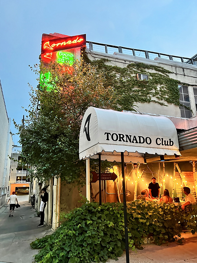 As evening falls, the Tornado's outdoor seating transforms into an urban oasis where steaks sizzle and conversations flow as freely as the cocktails.