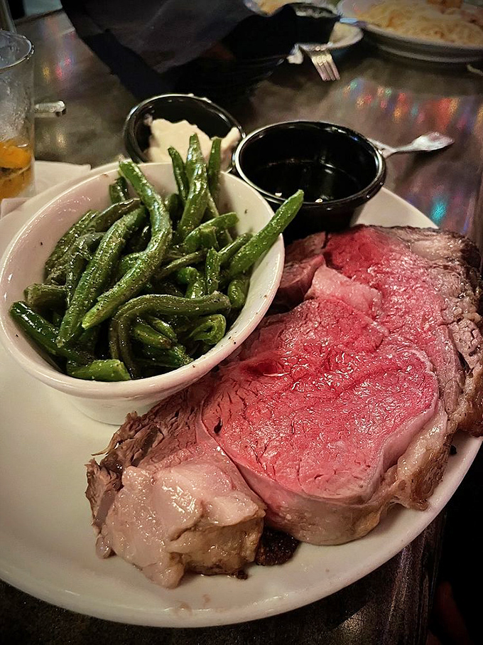 Prime rib so perfectly pink it could make a vegetarian question their life choices. Those green beans aren't just a garnish&mdash;they're delicious co-stars.