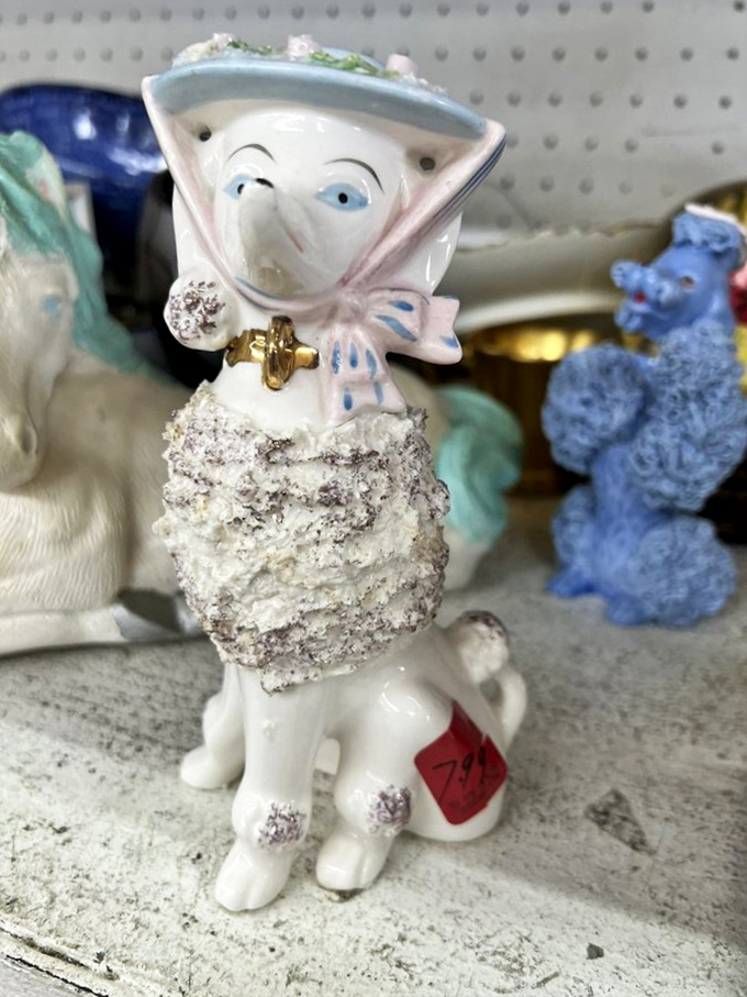 This peculiar porcelain poodle-person hybrid is exactly why thrift stores remain superior to boring retail &ndash; where else does $7 buy such conversation pieces?