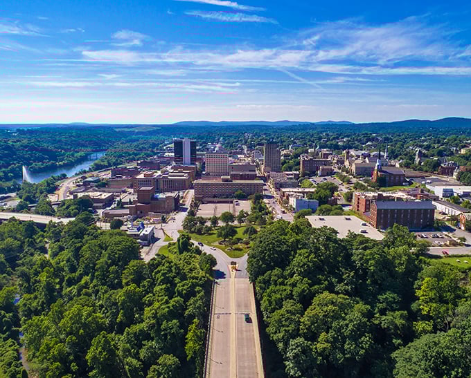 From above, Lynchburg reveals its clever urban planning—nestled between lush greenery and the James River like nature's perfect hug.