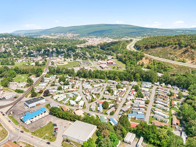 From above, Punxsutawney reveals its perfect small-town layout, nestled in Pennsylvania's rolling hills where your retirement dollars stretch like a yoga instructor.