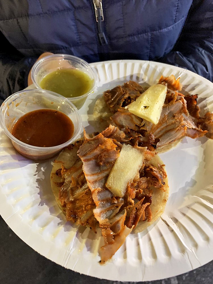 Al pastor tacos with the signature pineapple crown&mdash;proof that fruit on savory food isn't just for controversial pizza debates.