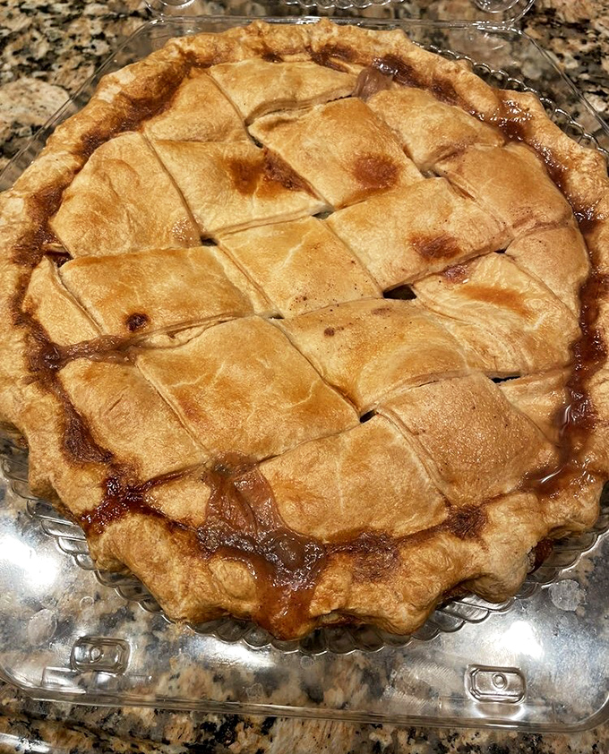 This lattice-topped apple pie isn't just dessert; it's edible American history with a golden crust that crackles like revolutionary musket fire.