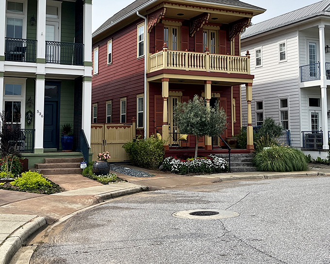 Historic homes in Pensacola's Aragon neighborhood stand shoulder-to-shoulder like old friends with stories to tell. That burgundy beauty in the middle is definitely the extrovert.