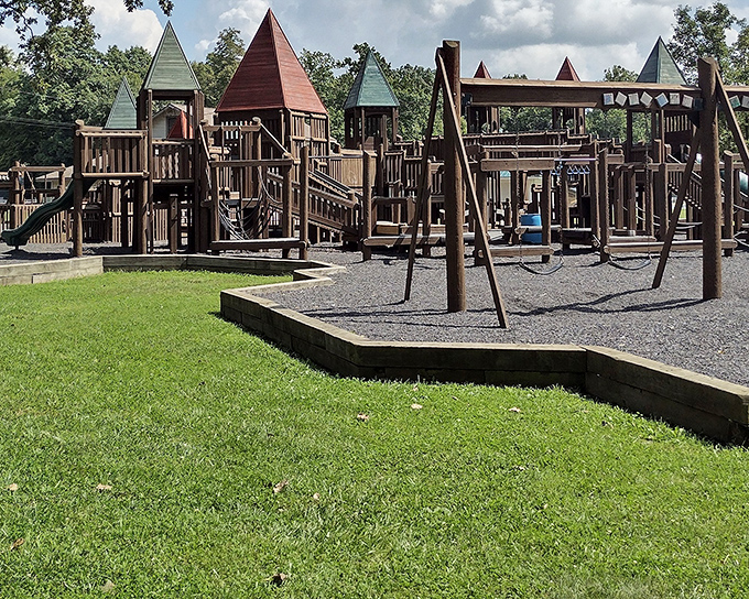 Aumiller Park's wooden castle playground is where imagination reigns supreme, a kingdom of childhood adventures waiting to be conquered.