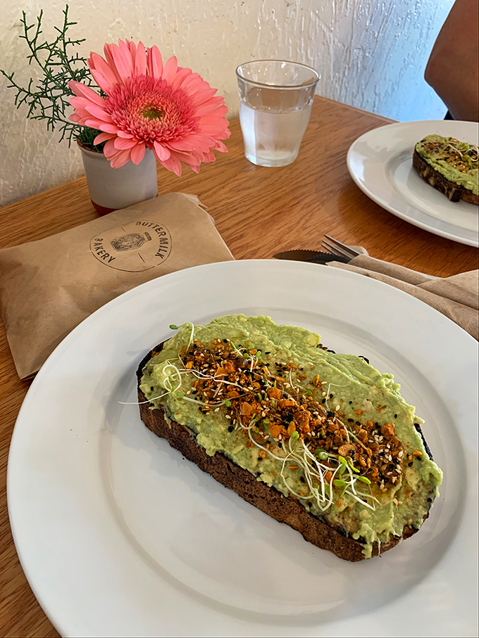 Behold the star of our show: avocado toast that makes millennials' financial decisions suddenly seem reasonable. That sprinkle of everything bagel seasoning is the crown jewel.