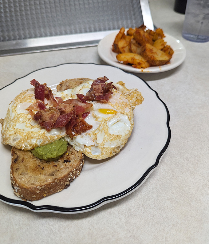 Avocado toast that doesn't require a second mortgage&mdash;just perfectly runny eggs, crispy bacon, and creamy avocado on hearty bread that Instagram wishes it could taste.