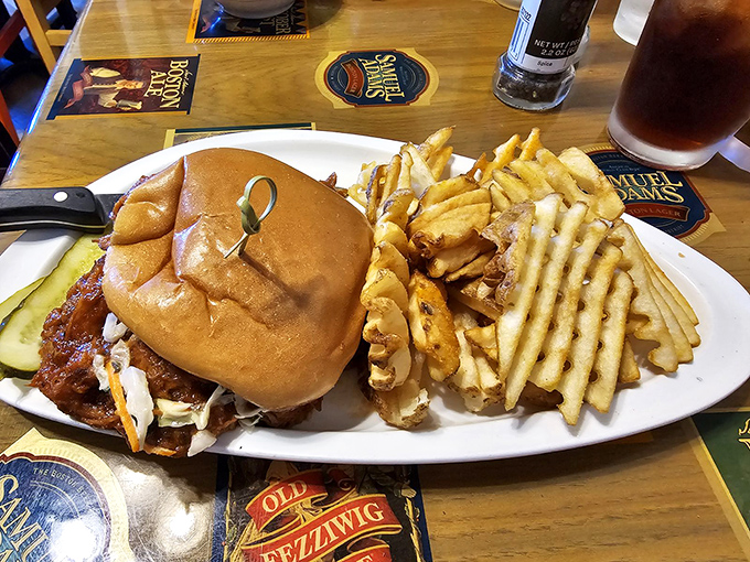 This isn't just a sandwich; it's an architectural marvel of BBQ pork that requires both hands and several napkins.