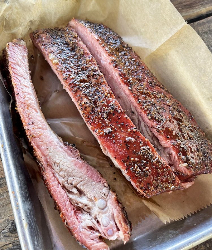These ribs have the kind of perfect pink smoke ring that makes BBQ enthusiasts weak in the knees. Tender enough to bite, substantial enough to satisfy.