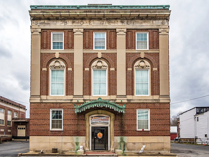The stately BPOE Temple building whispers of secret handshakes and community service projects, standing proud like your grandfather in his Sunday best.