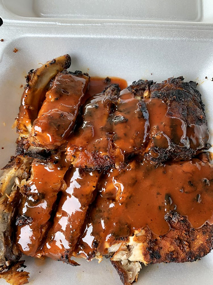 The sauce-to-char ratio here is mathematical perfection. These baby backs aren't just falling off the bone&mdash;they're practically jumping into your mouth.