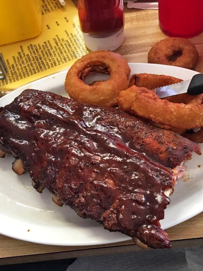 These baby back ribs don't just fall off the bone&mdash;they practically leap into your mouth. Paired with golden onion rings, it's the kind of plate that makes diets weep