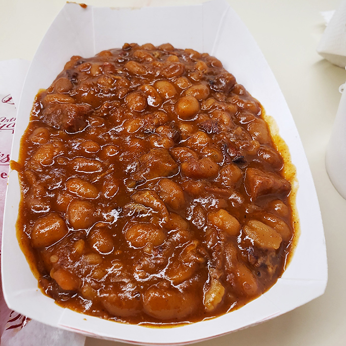 These aren't just baked beans; they're a molasses-rich supporting actor that steals scenes from the barbecue stars they accompany. 