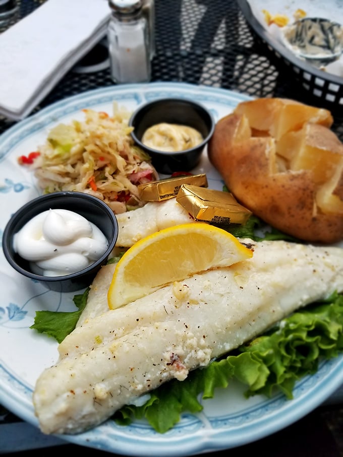 This isn't just fish &ndash; it's a pristine fillet of white fish resting on a bed of greens, with butter pats melting like little gold medals.